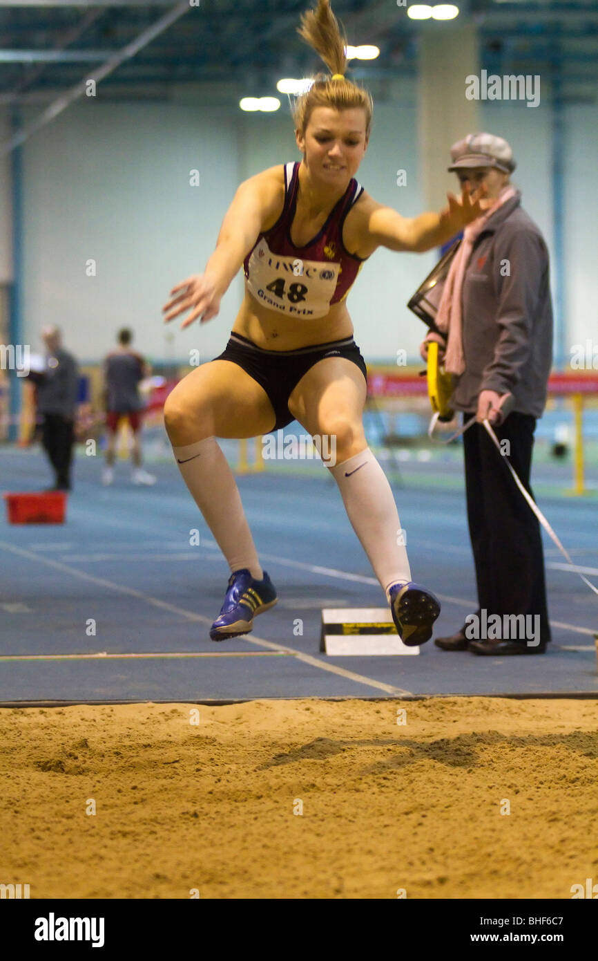 Female athlete competing in the triple jump/long jump Stock Photo - Alamy