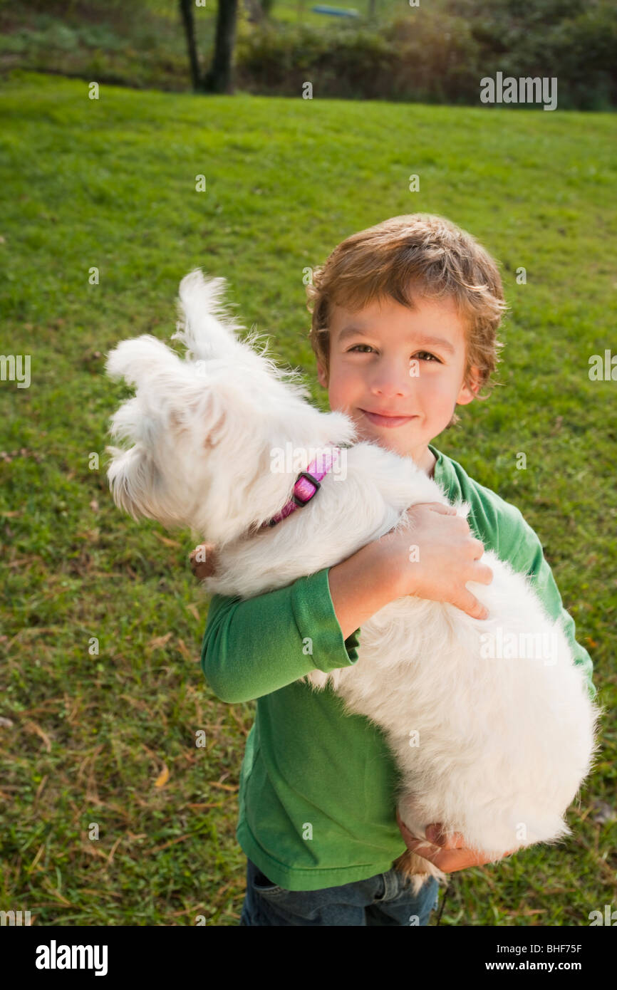 Boy with small dog hi-res stock photography and images - Alamy