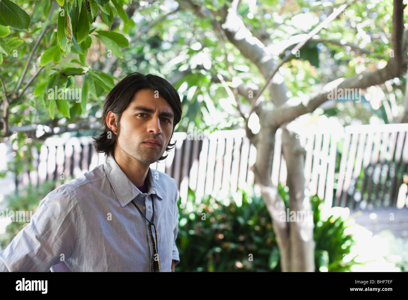 Hispanic man frowning outdoors Stock Photo - Alamy