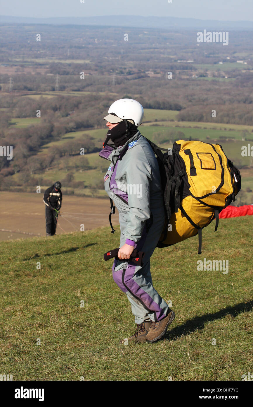 A paraglider with kit on his back Stock Photo - Alamy