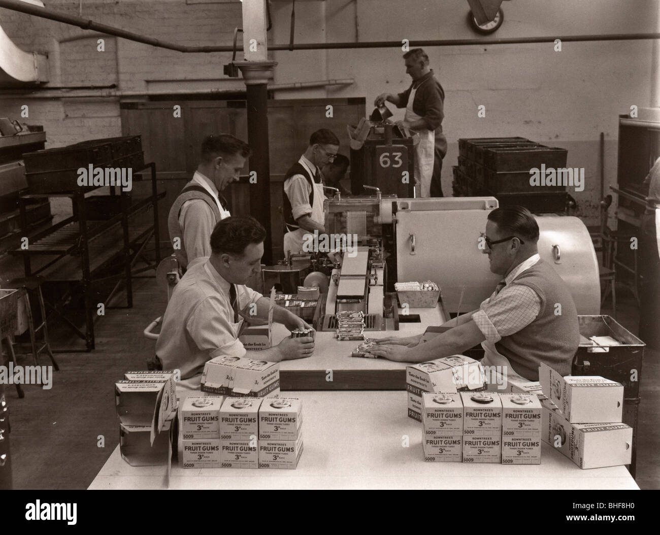 Men wrapping Rowntree's Fruit Gums and packing into boxes, Rowntree ...