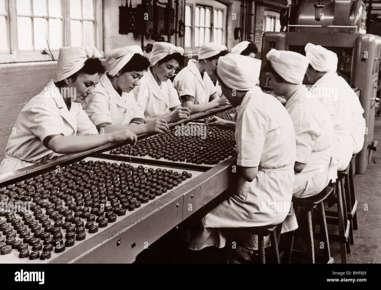 Decorating chocolates by hand, Rowntree factory, York, Yorkshire, 1956 ...