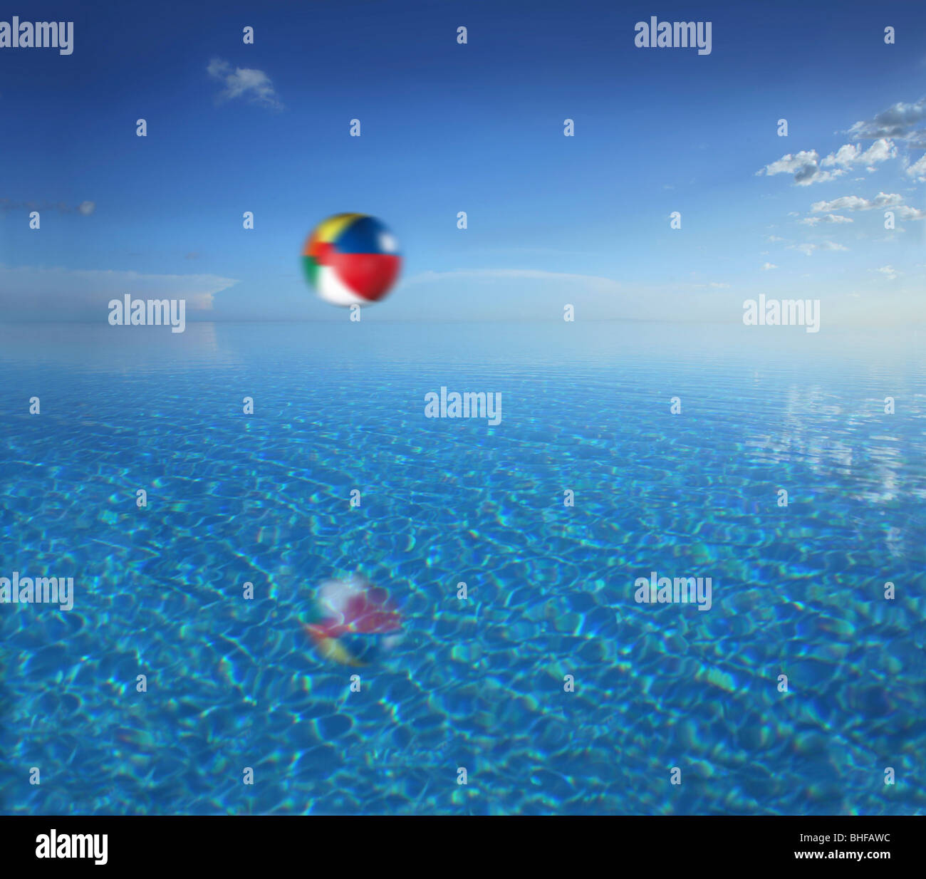 Beach ball above the water of an infinity pool, Bohol, Philippines ...
