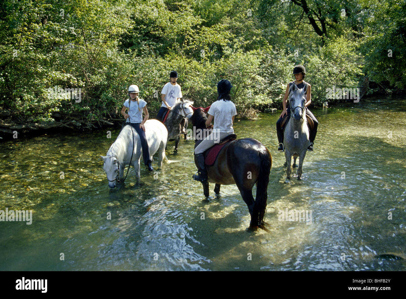 Children riding horses hi-res stock photography and images - Alamy