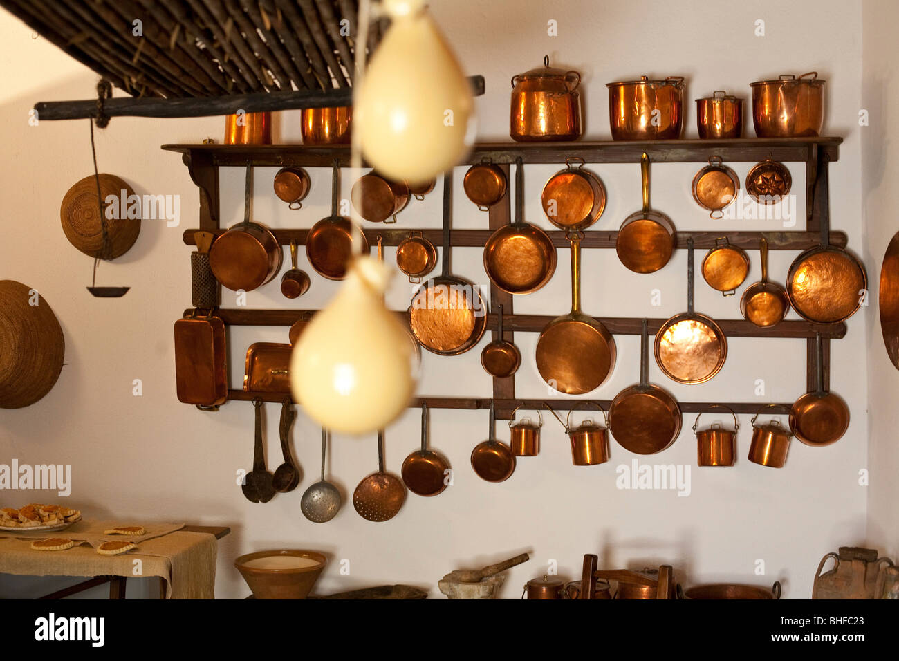Rack with copper pots in the kitchen, Museum Grazia Deledda, Nuoro ...