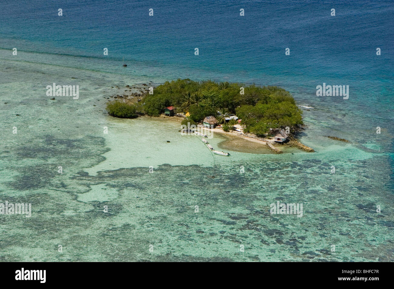 Aerial view of a deserted island with houses of fishermen, Pohnpei ...