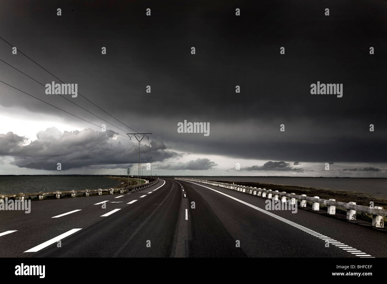 Stormy weather, causeway, Romo, Denmark Stock Photo - Alamy