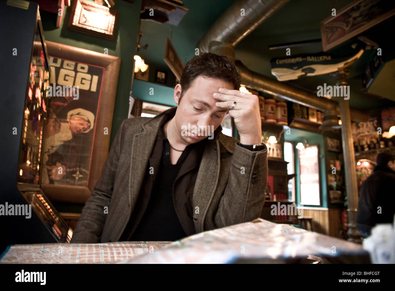 Tapas bar with bar man and man sitting at bar hi-res stock photography ...