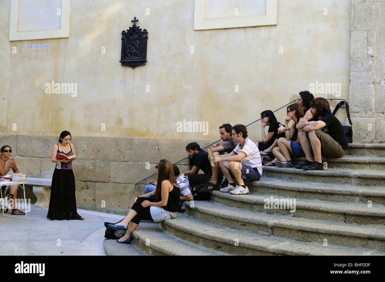 People sitting on stairs at the Marina quarter, Cagliari, Sardinia ...