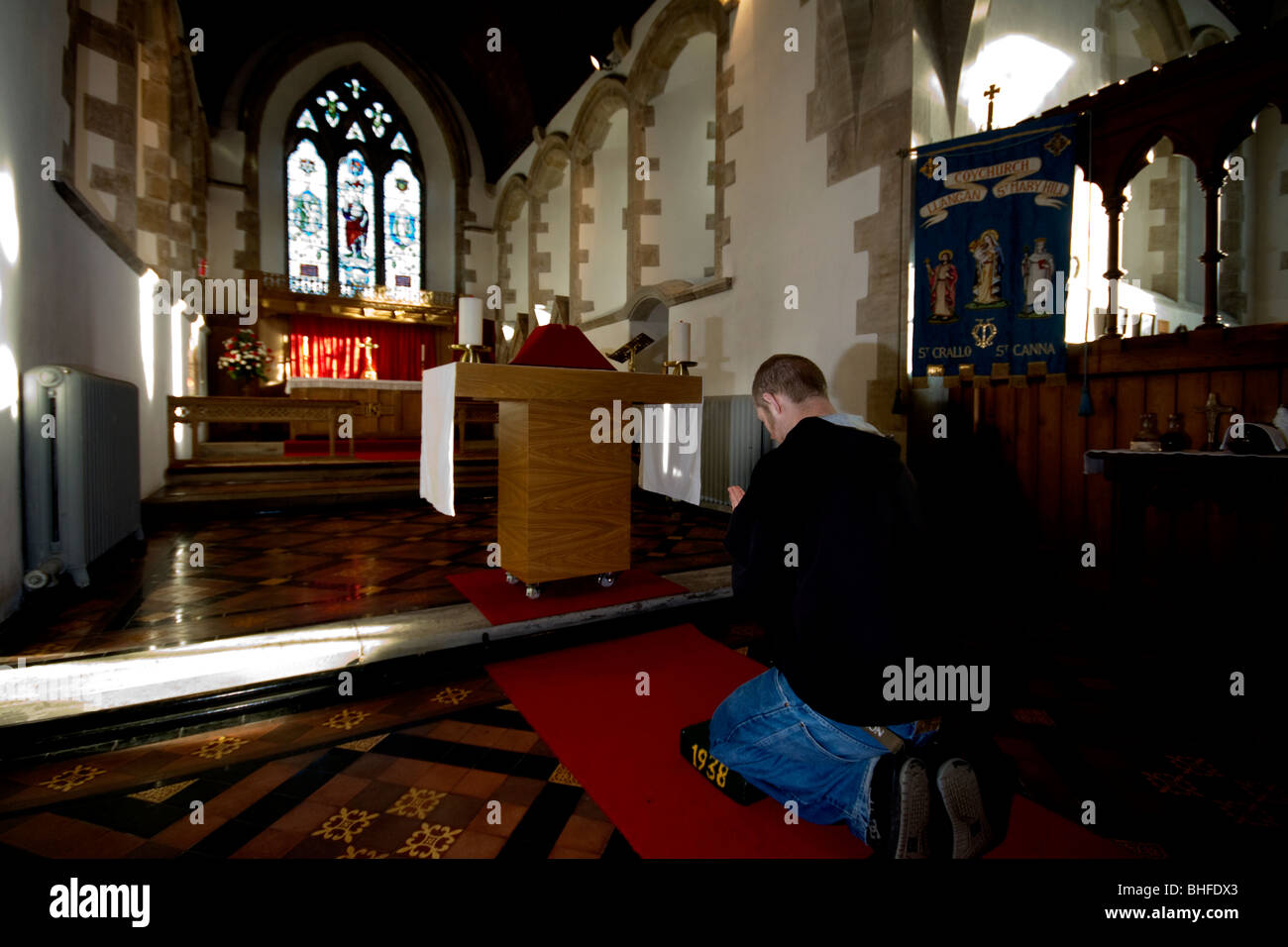Man praying in a church Stock Photo - Alamy