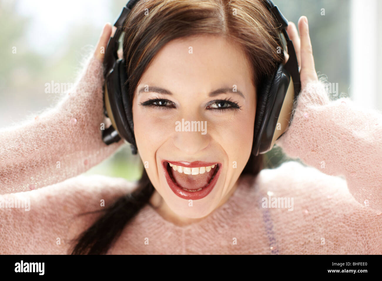 Happy girl wearing headphones Stock Photo - Alamy