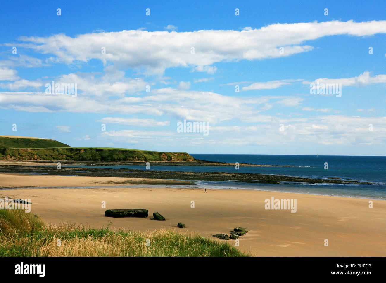 Sandy beach under clouded sky, Whiting Bay Beach, County Waterford ...