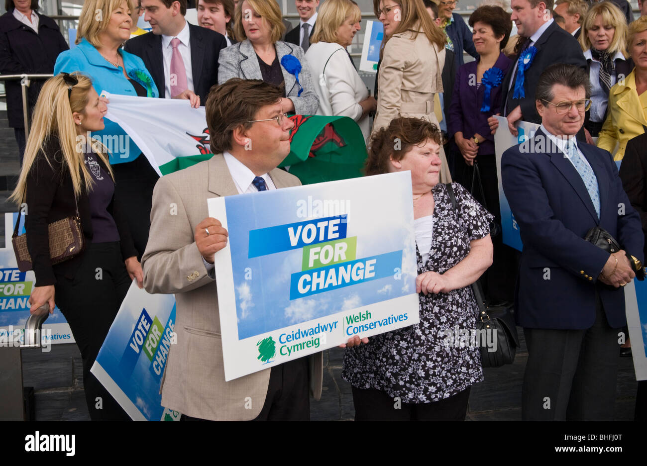 Conservative Party supporters with flags and banners at a gathering ...