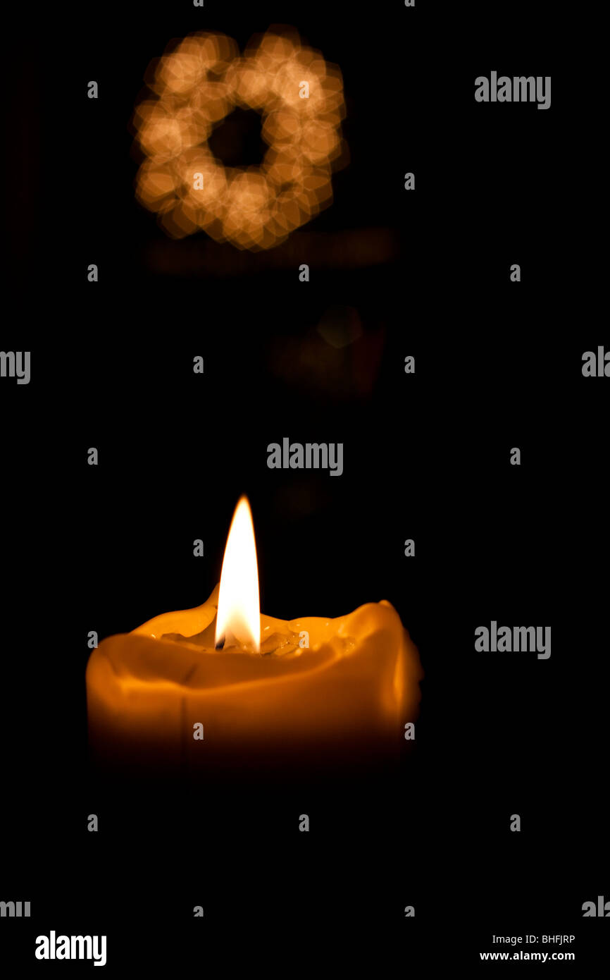 1 candle with reflection Stock Photo - Alamy