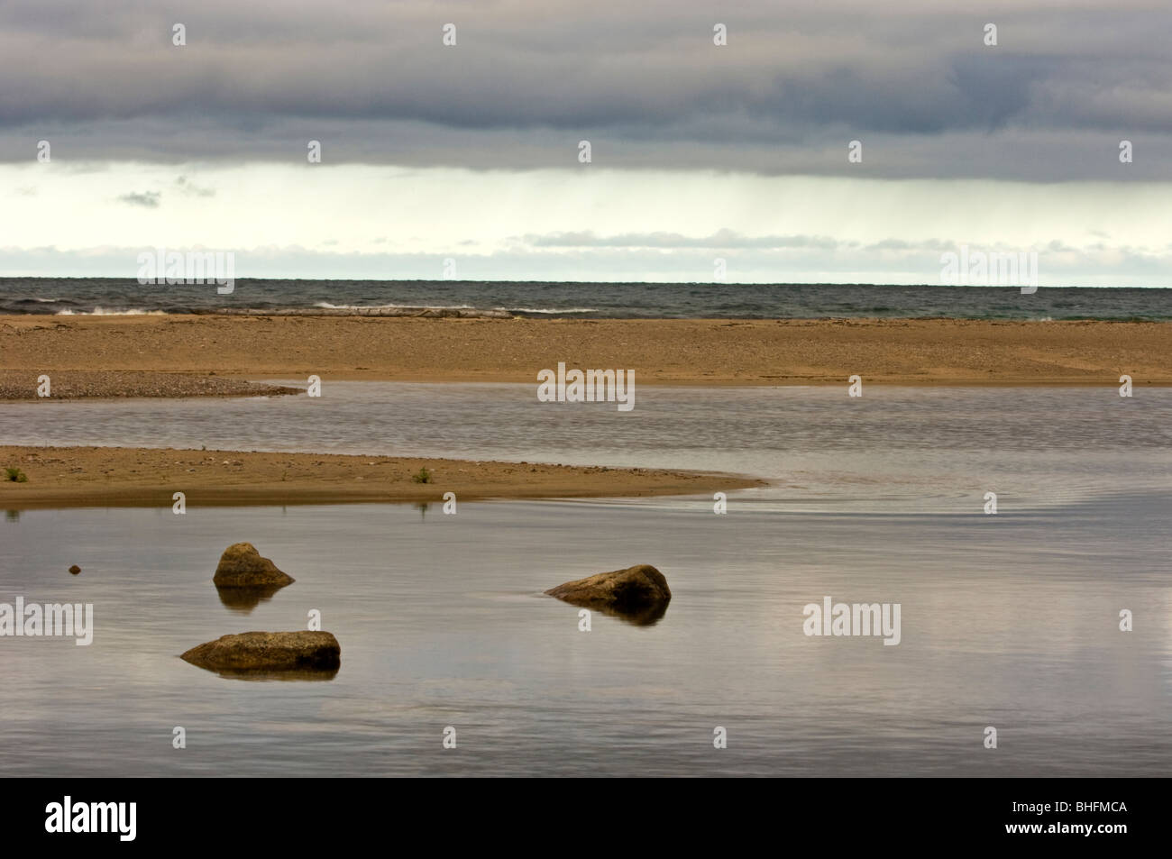 Sand bars and boulders at mouth of the Sand River with Lake Superior ...