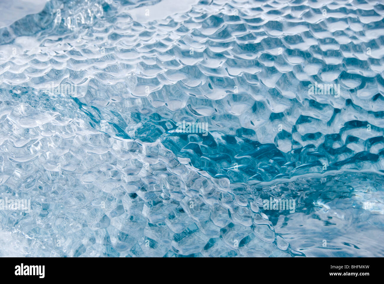 Hard glacial ice that has had all the air bubbles forced out by ...