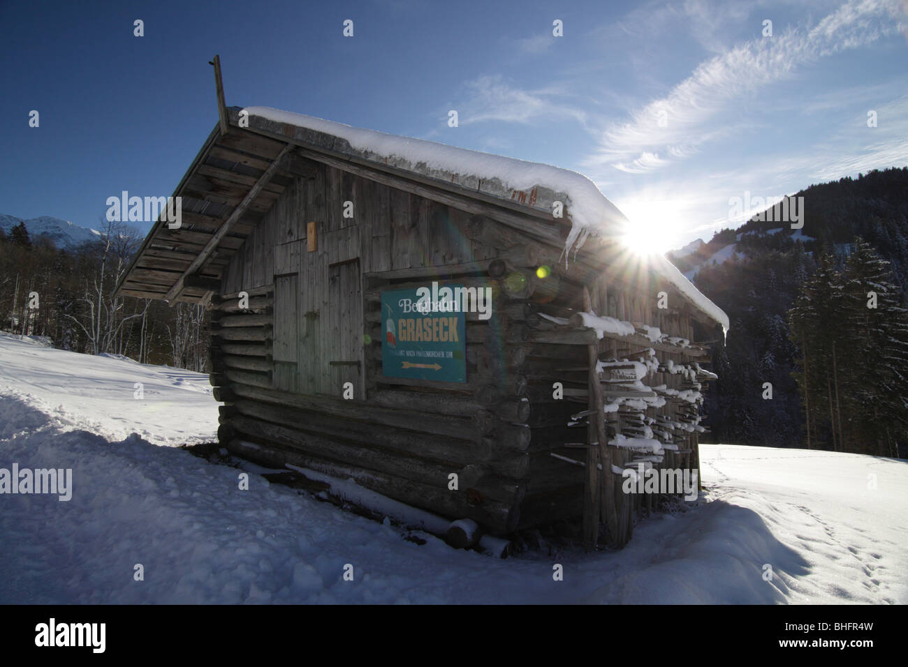 A hut in the Alps with a sign for the Graseck cable car on a clear ...