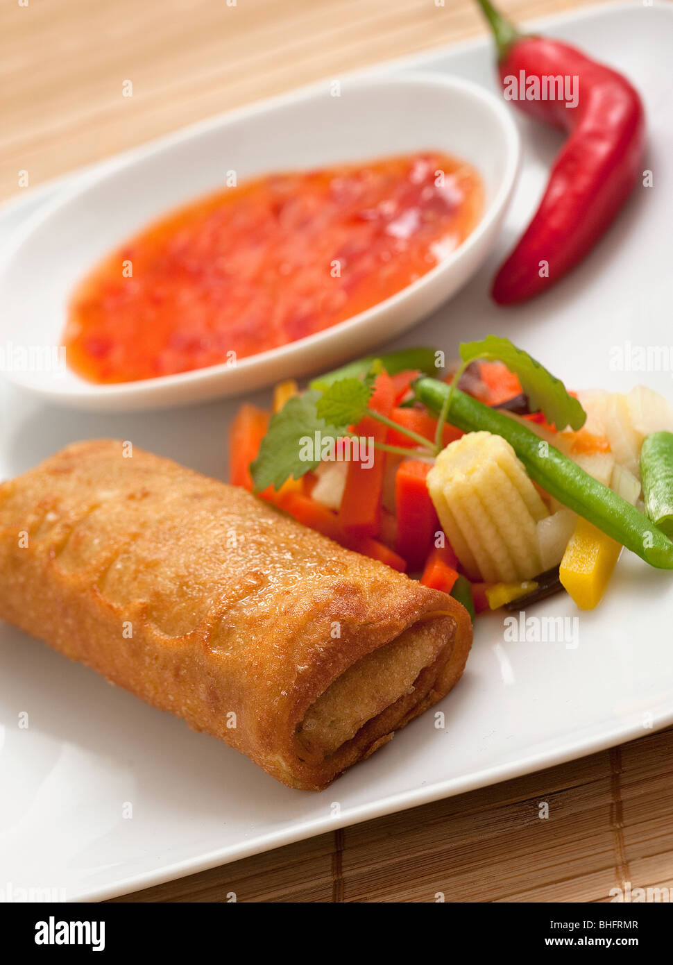 an asian spring roll and fresh vegetables Stock Photo - Alamy