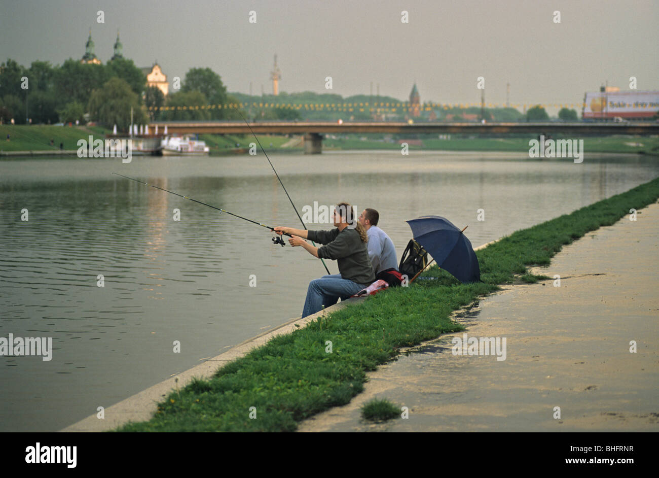 People fishing on the bank of Vistula river, Krakow, Poland Stock Photo ...