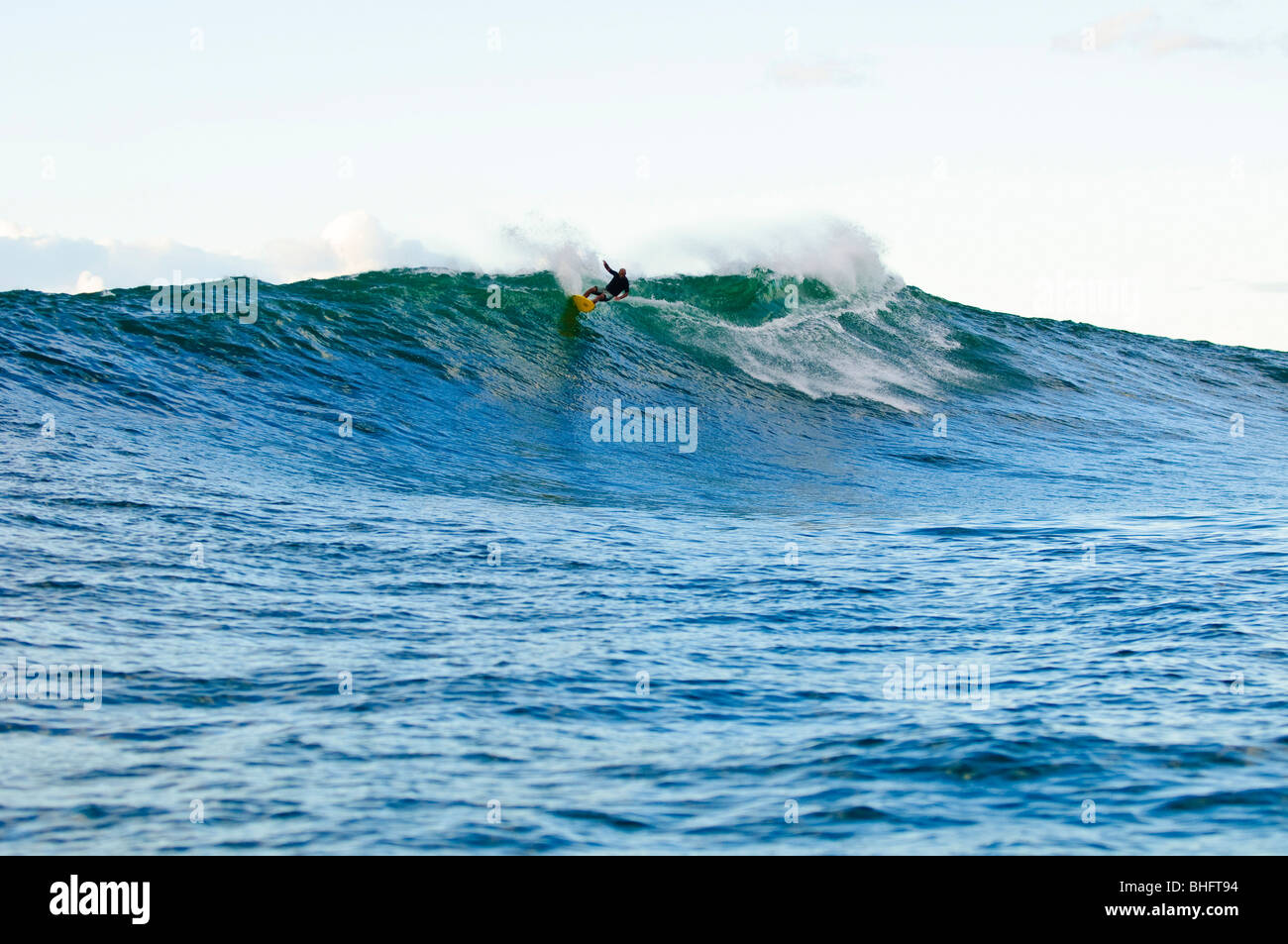 Tow-in surfer on big wave, Hawaii Stock Photo - Alamy