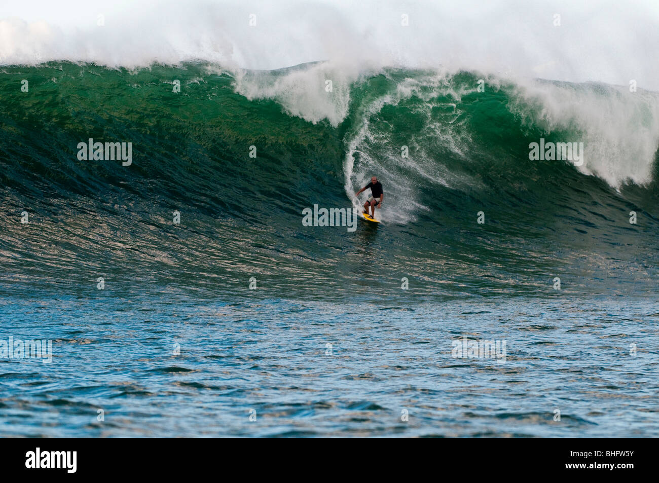 Tow-in surfer on big wave, Hawaii Stock Photo - Alamy