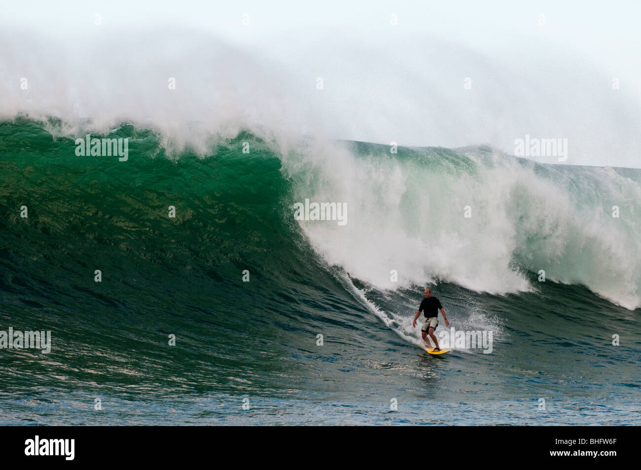 Tow-in surfer on big wave, Hawaii Stock Photo - Alamy