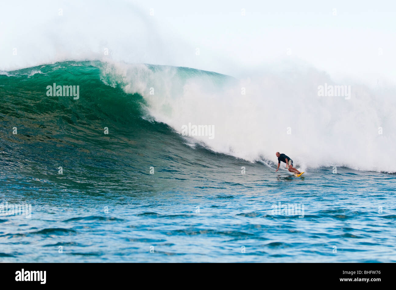 Tow-in surfer on big wave, Hawaii Stock Photo - Alamy