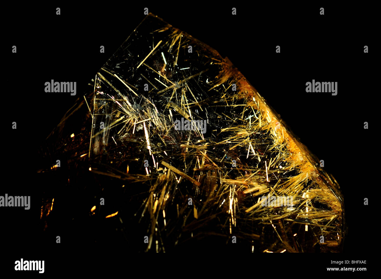 Rutile (TiO2) needles growing inside quartz crystal Stock Photo - Alamy