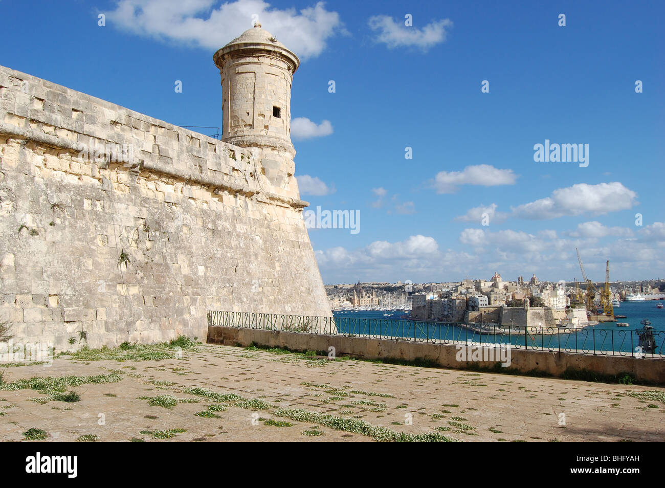 Malta's defense wall and watch tower look out towards the Mediterranean ...