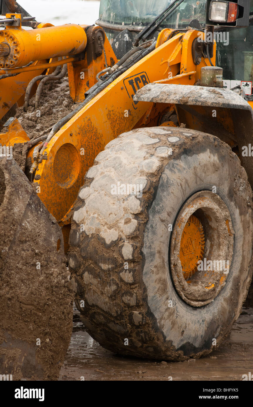 Bulldozer deep in mud and snow Stock Photo - Alamy