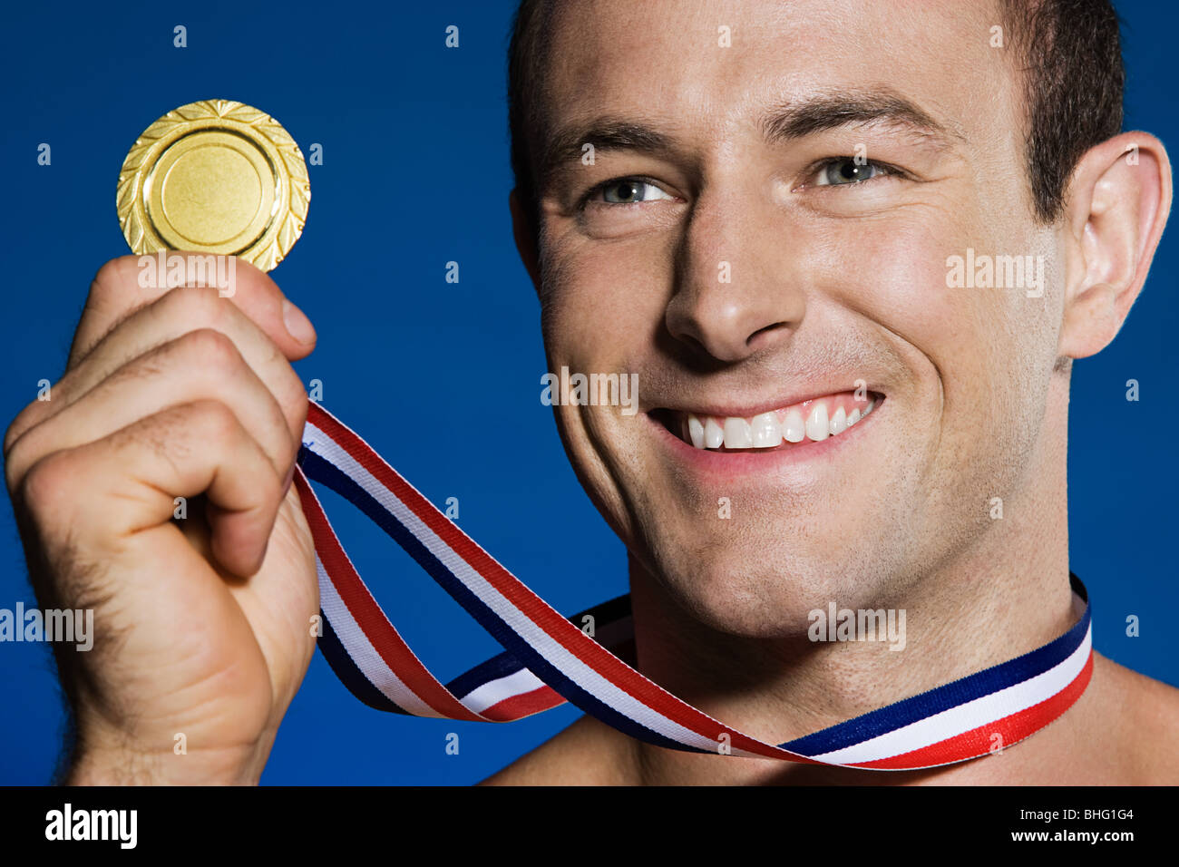Holding gold olympic medal hi-res stock photography and images - Alamy
