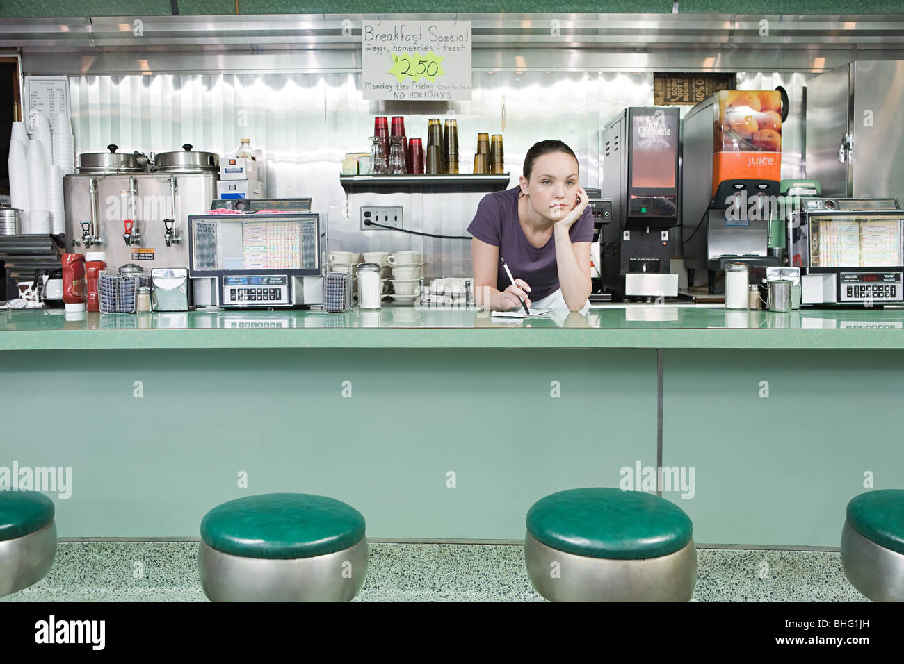 Bored waitress in a diner Stock Photo - Alamy