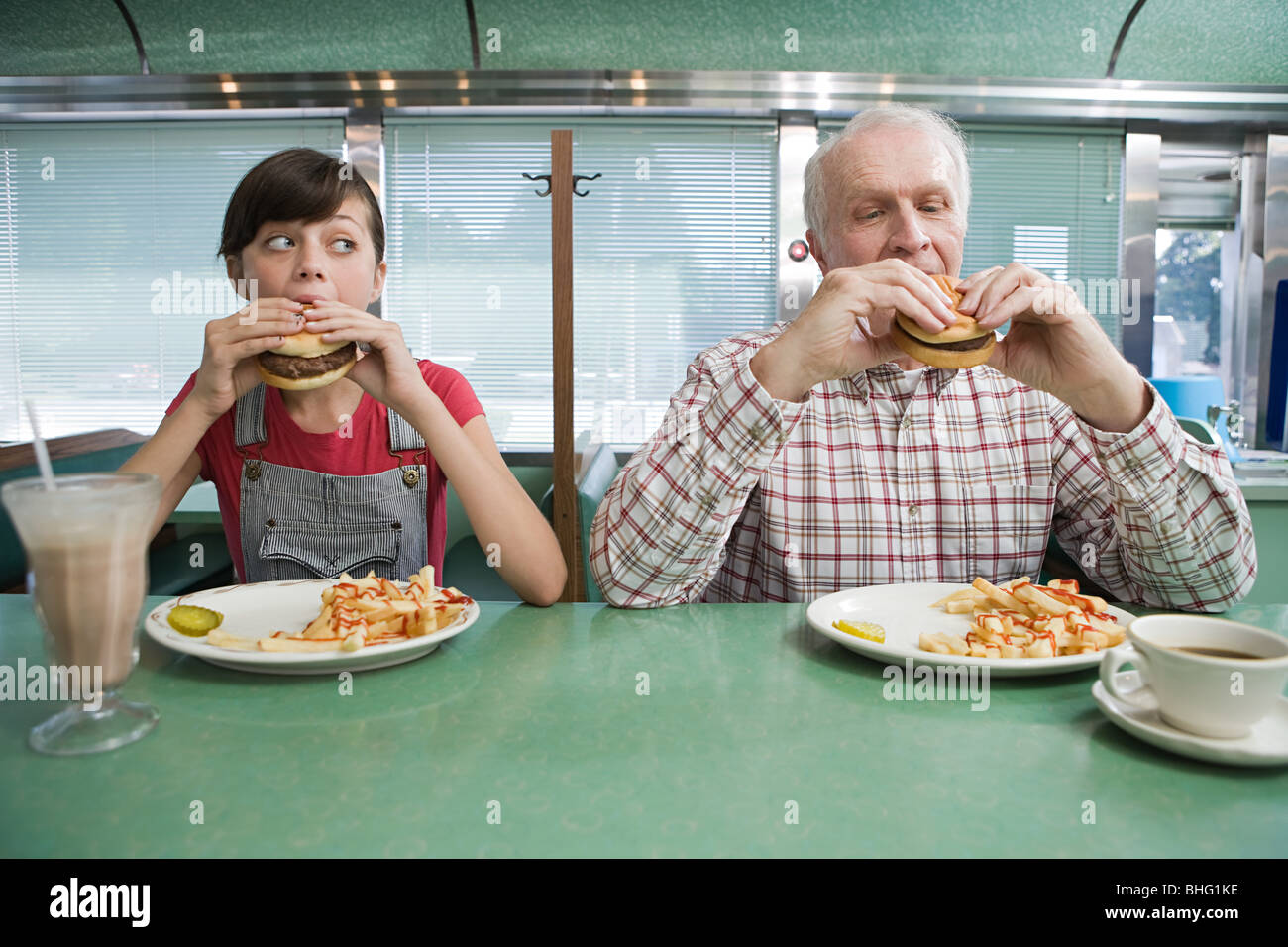 Family Eating At Fast Food Restaurant