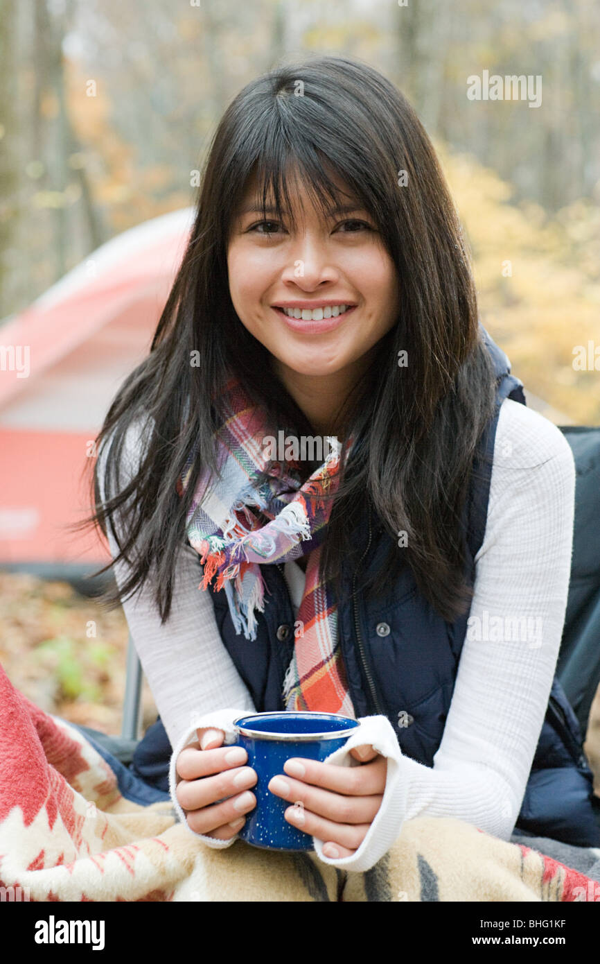 Young woman camping Stock Photo - Alamy