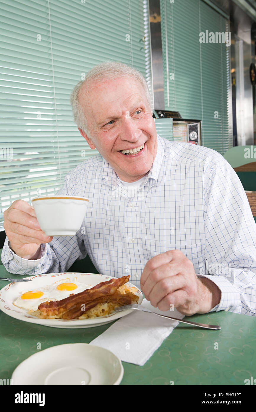 Man eating english breakfast hi-res stock photography and images - Alamy