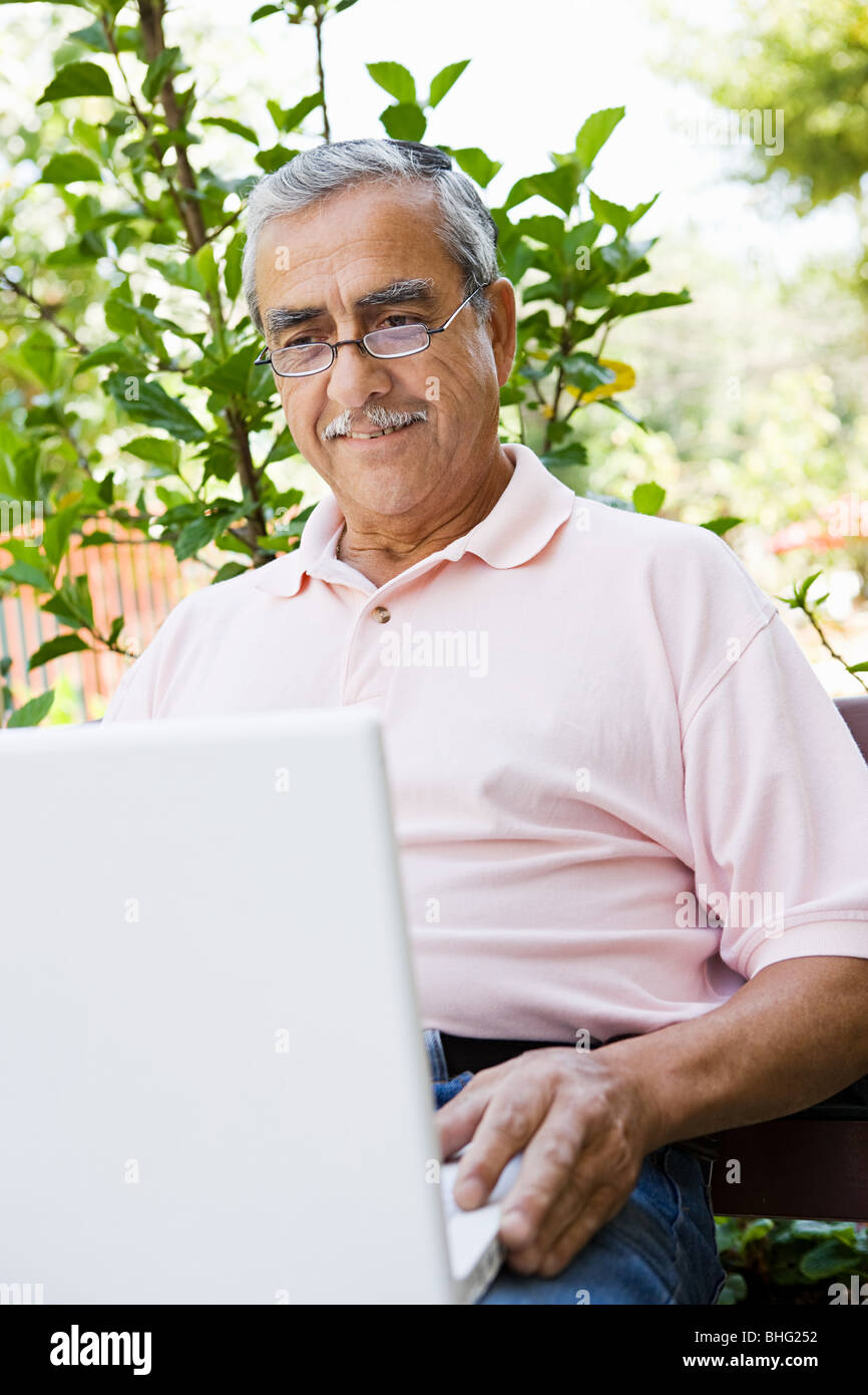 Senior man with laptop computer Stock Photo - Alamy