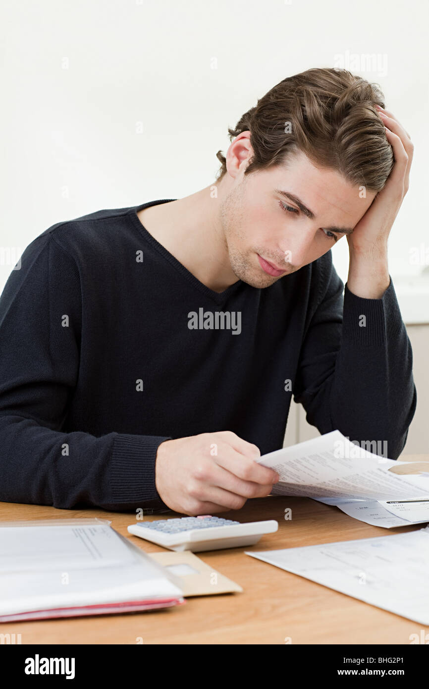 Man paperwork calculator hi-res stock photography and images - Alamy
