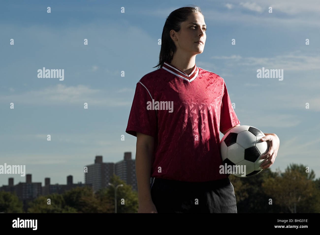 Female football player standing ball hi-res stock photography and ...