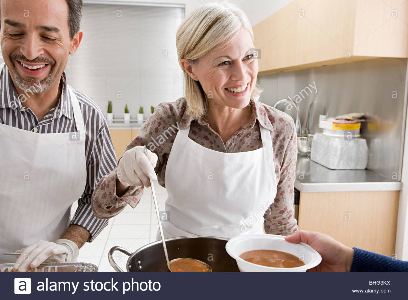 People Volunteering Soup Kitchen Stock Photos & People Volunteering ...