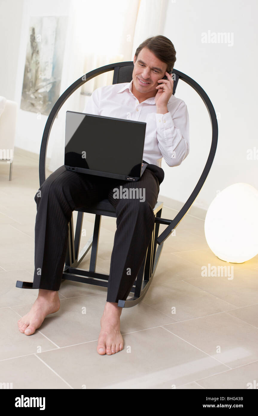 handsome man multitasking Stock Photo - Alamy