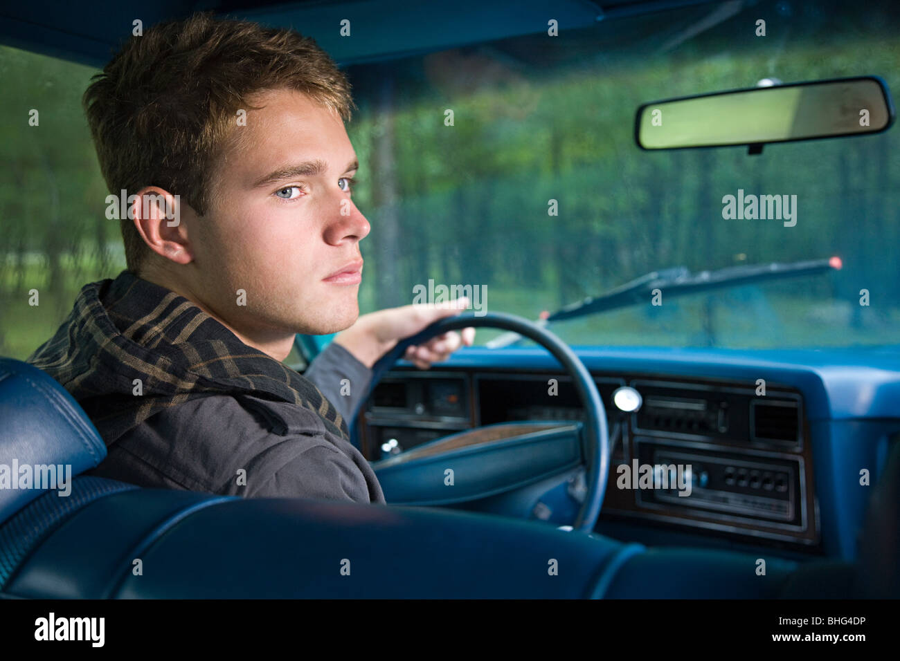 Teenage boy in car Stock Photo - Alamy