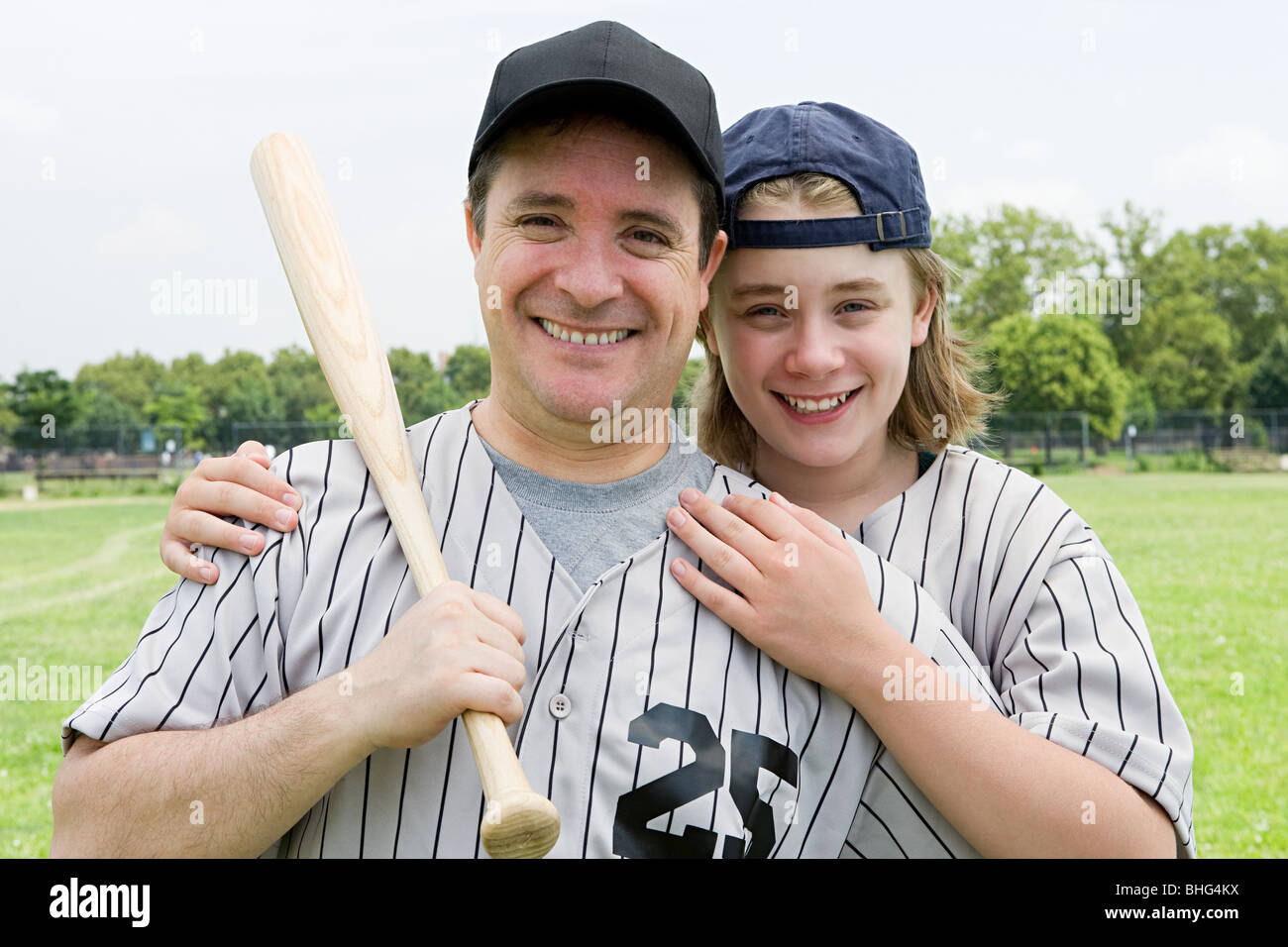 Father and son on baseball field Stock Photo - Alamy