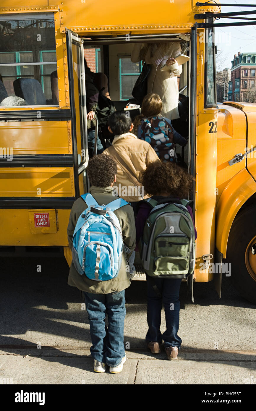 Children boarding school bus hi-res stock photography and images - Alamy