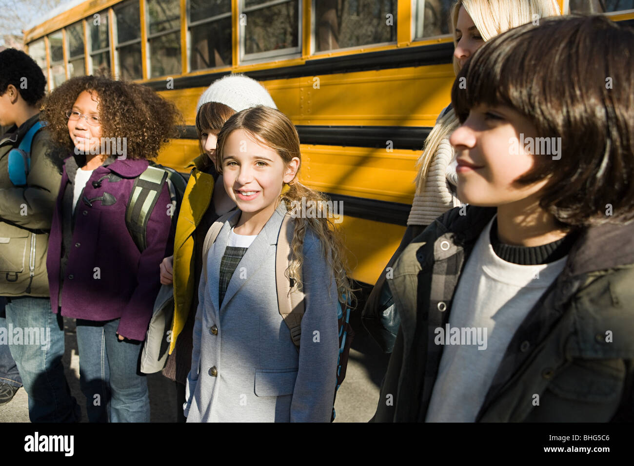 Children by school bus Stock Photo - Alamy