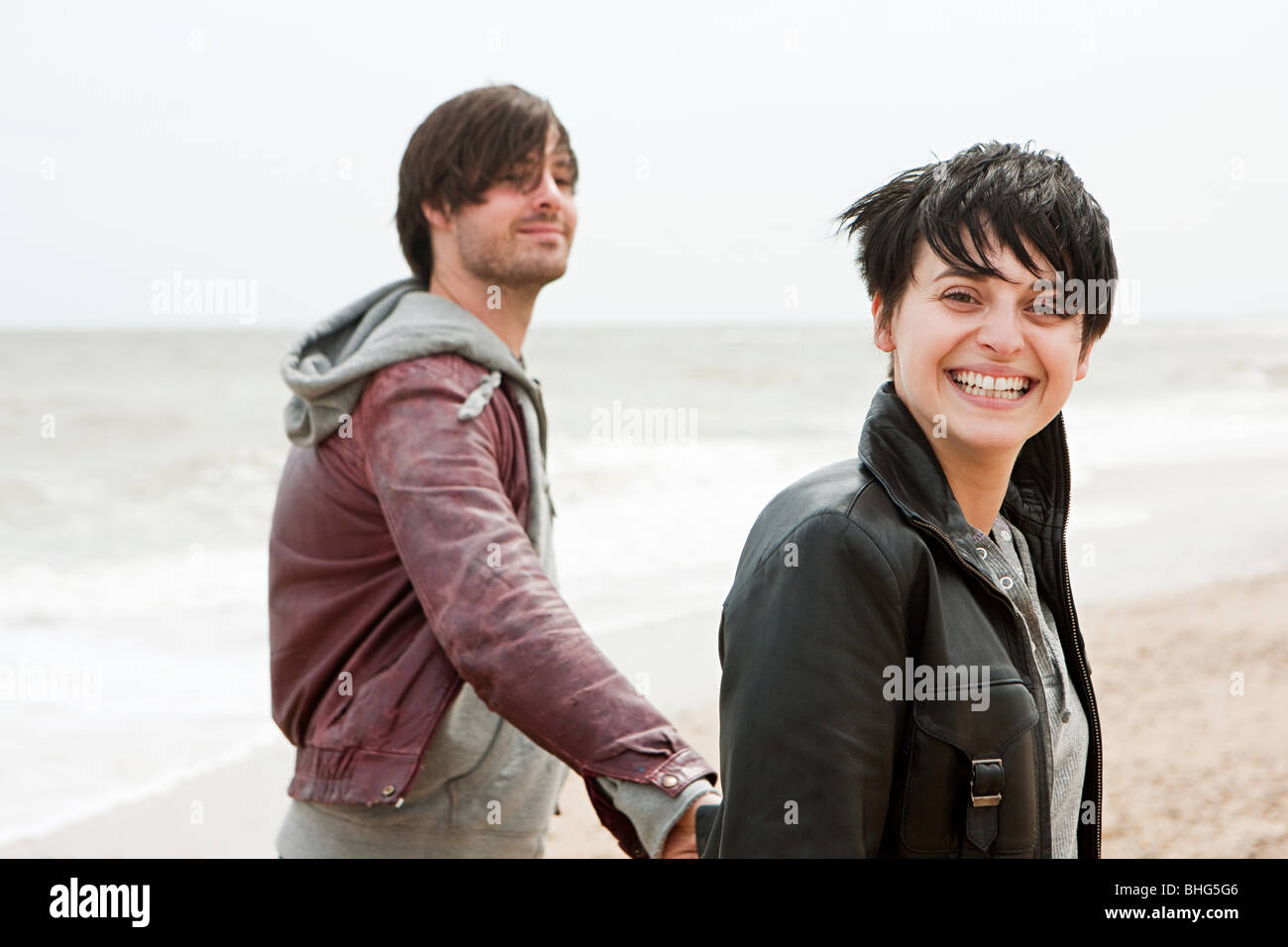 Young couple by the sea Stock Photo - Alamy