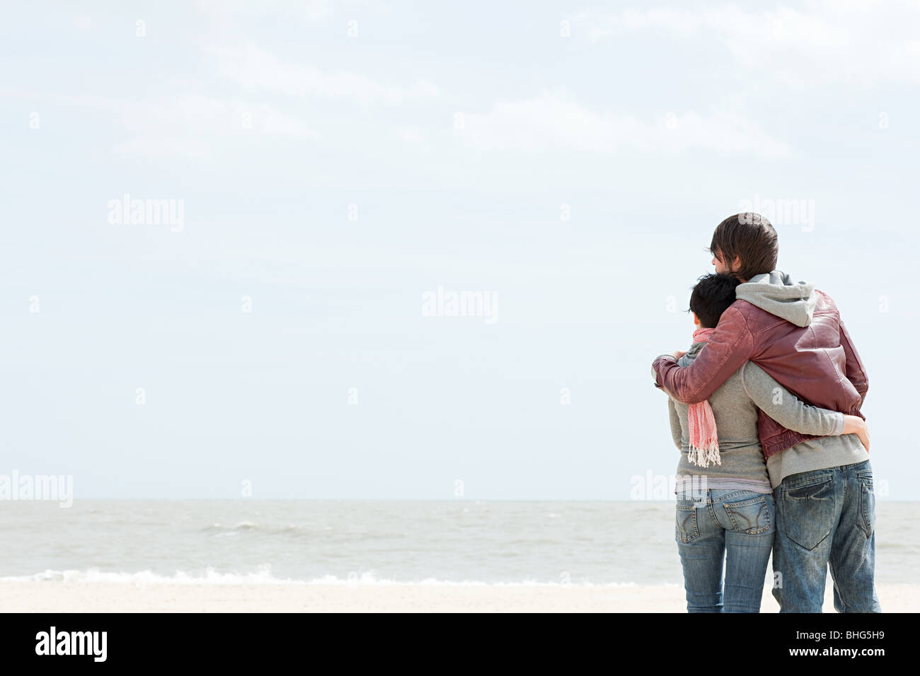 Young couple by the sea Stock Photo - Alamy