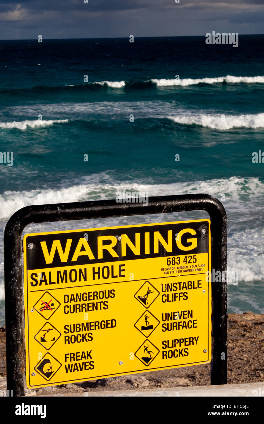 Warning sign on beach Stock Photo - Alamy