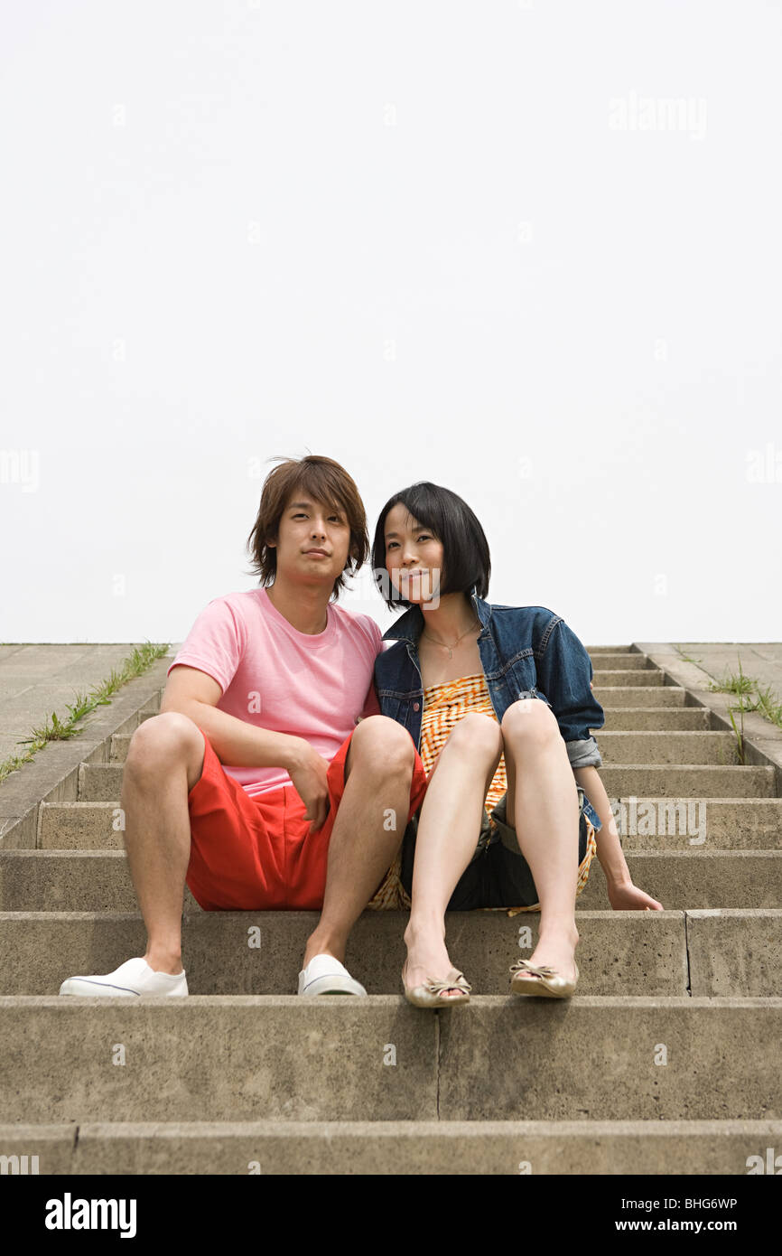 East asian couple on steps hi-res stock photography and images - Alamy