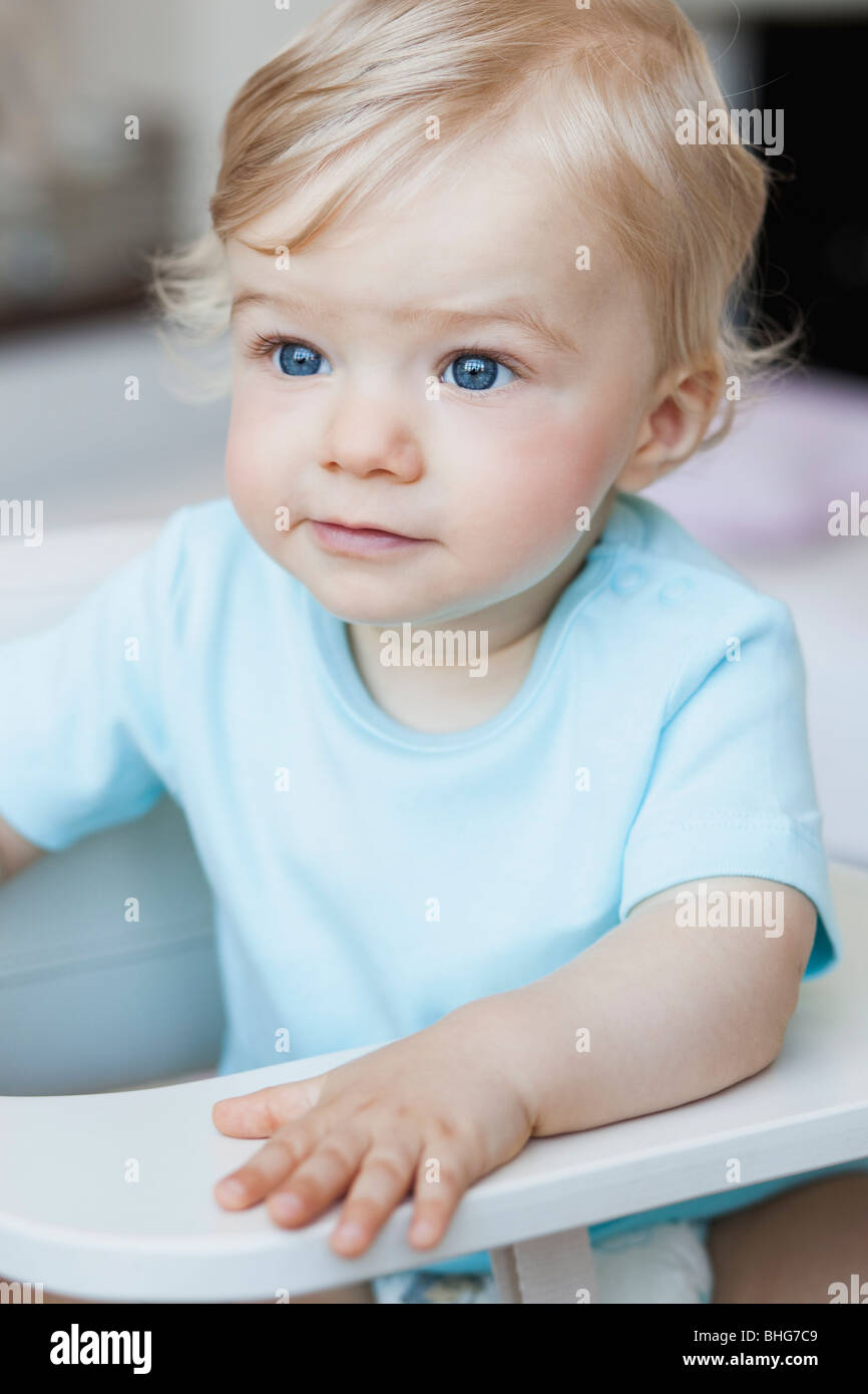 baby sitting in chair Stock Photo - Alamy