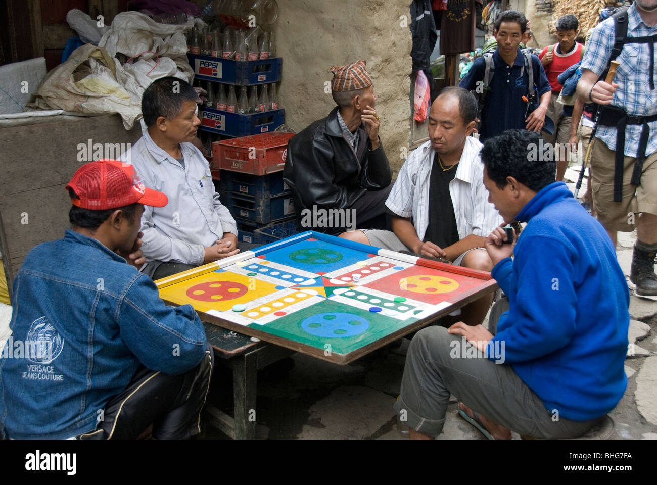 Men playing board game in street, Jagat, Annapurna Circuit, Nepal Stock ...